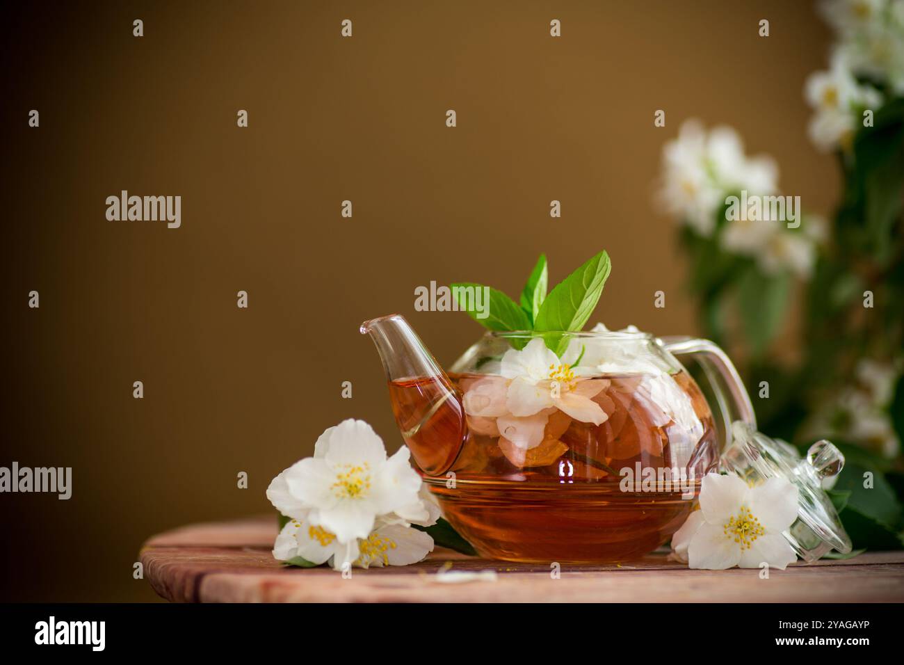 jasmine flower tea in a glass teapot Stock Photo - Alamy