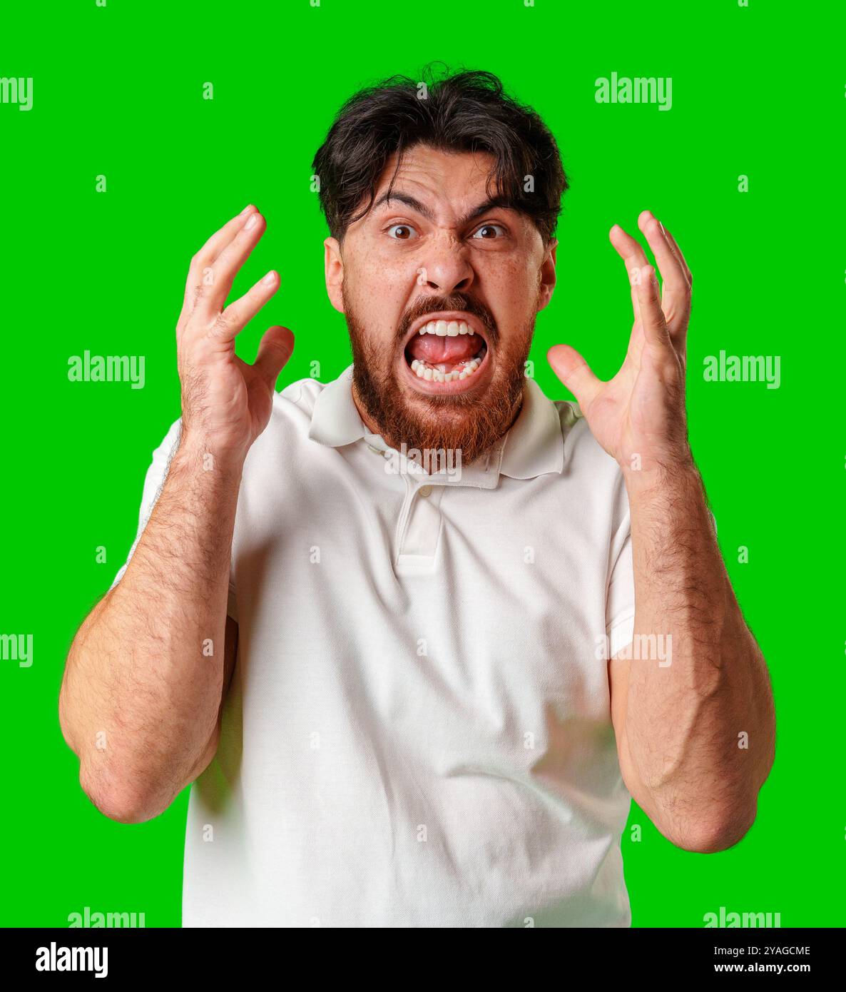 A man expresses intense frustration with a furious gesture against a ...