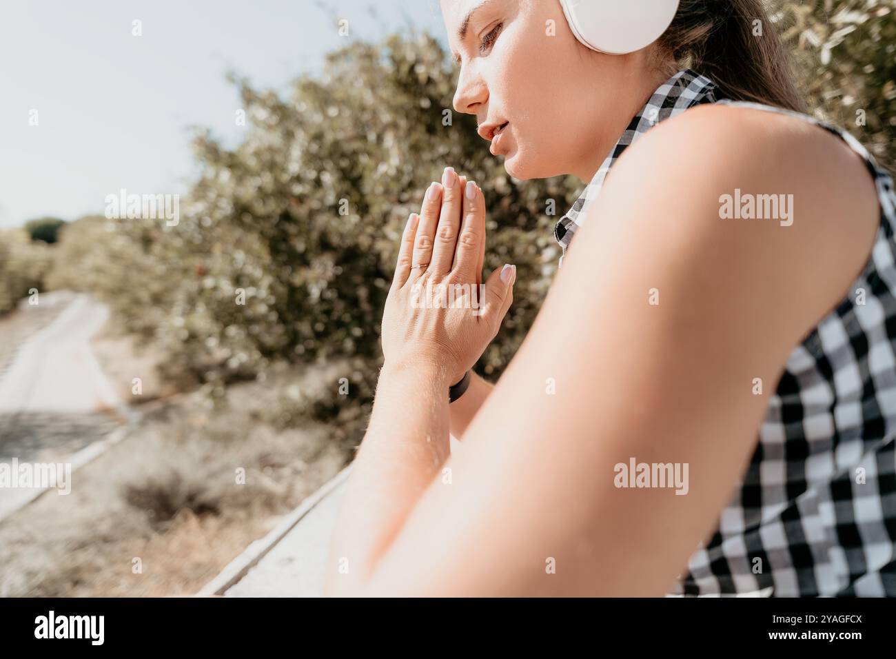 Woman Praying with Hands Together, Outdoors Stock Photo - Alamy