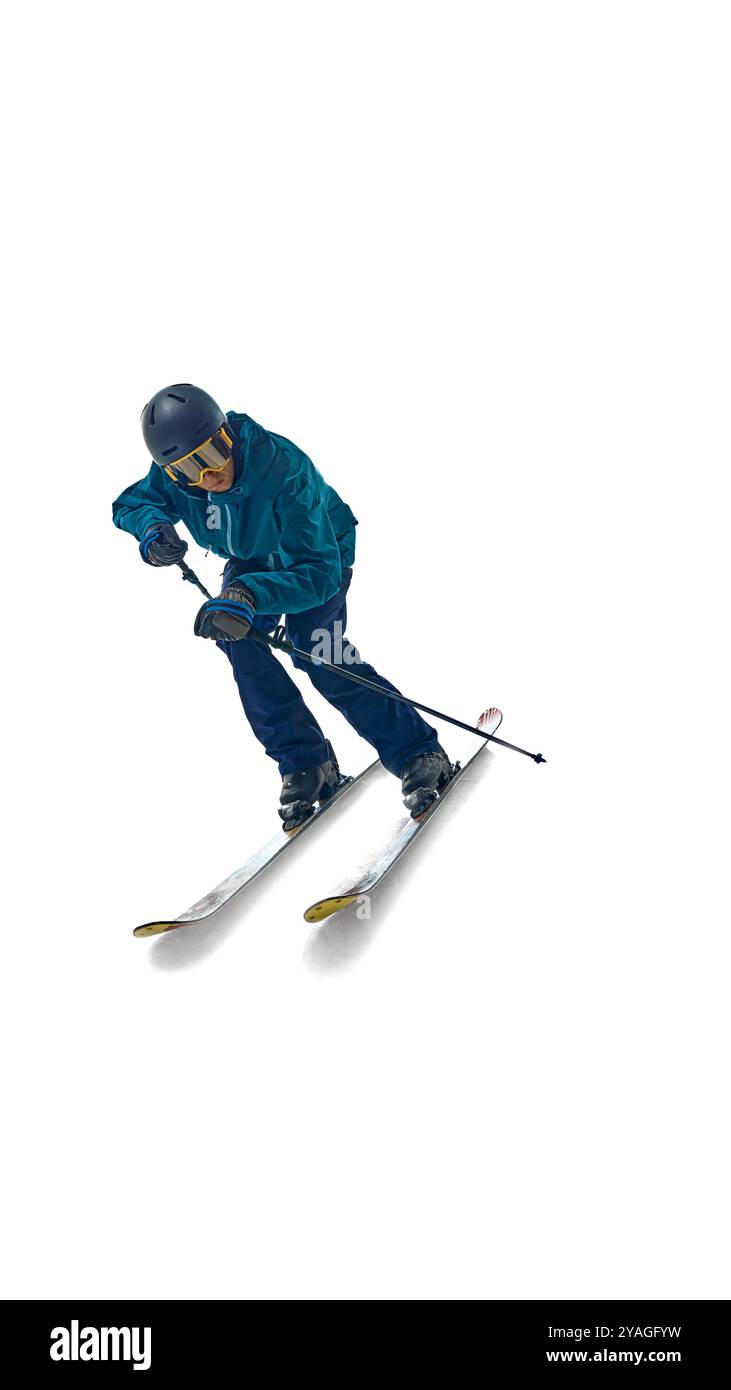 Athlete dressed in blue gear, poised and focused, mid-slope, leaning ...