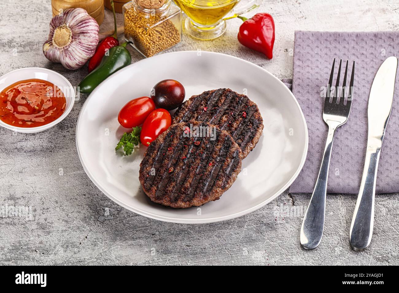 Grilled beef burger cutlet with sauce Stock Photo - Alamy