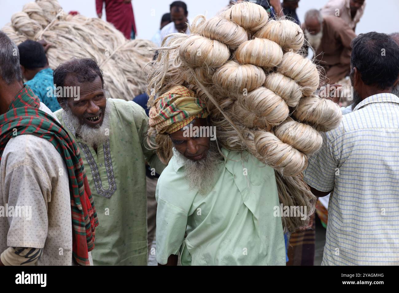 October 14, 2024, Jamalpur, Jamalpur, Bangladesh: Worker carries huge ...