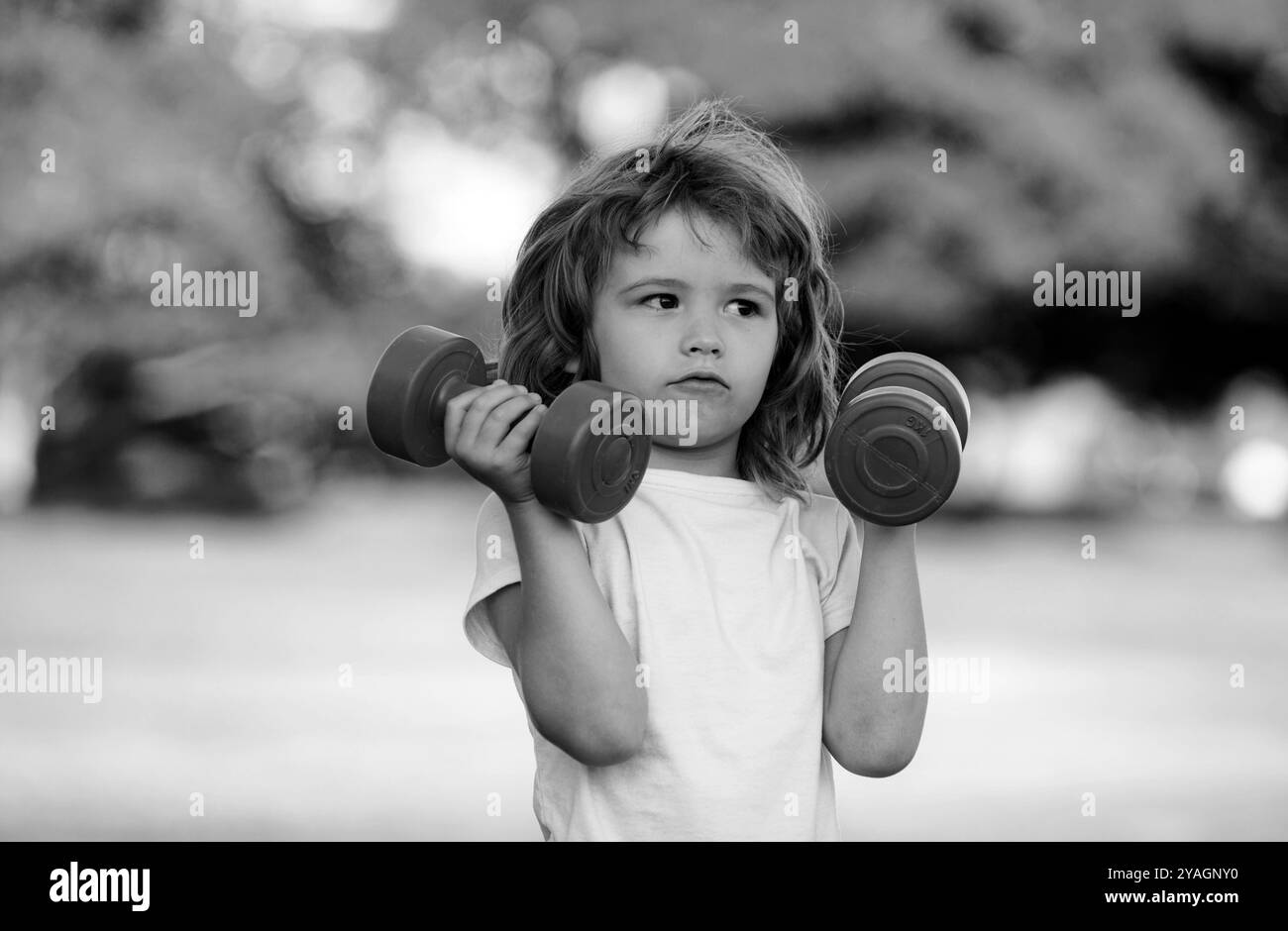 Sporty child with dumbbells. Kids sport and fitness, health and energy ...