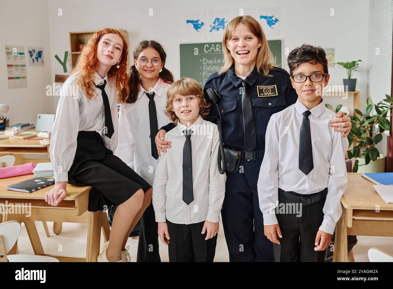 Police Officer And Group Of Teenagers In Classroom Stock Photo - Alamy