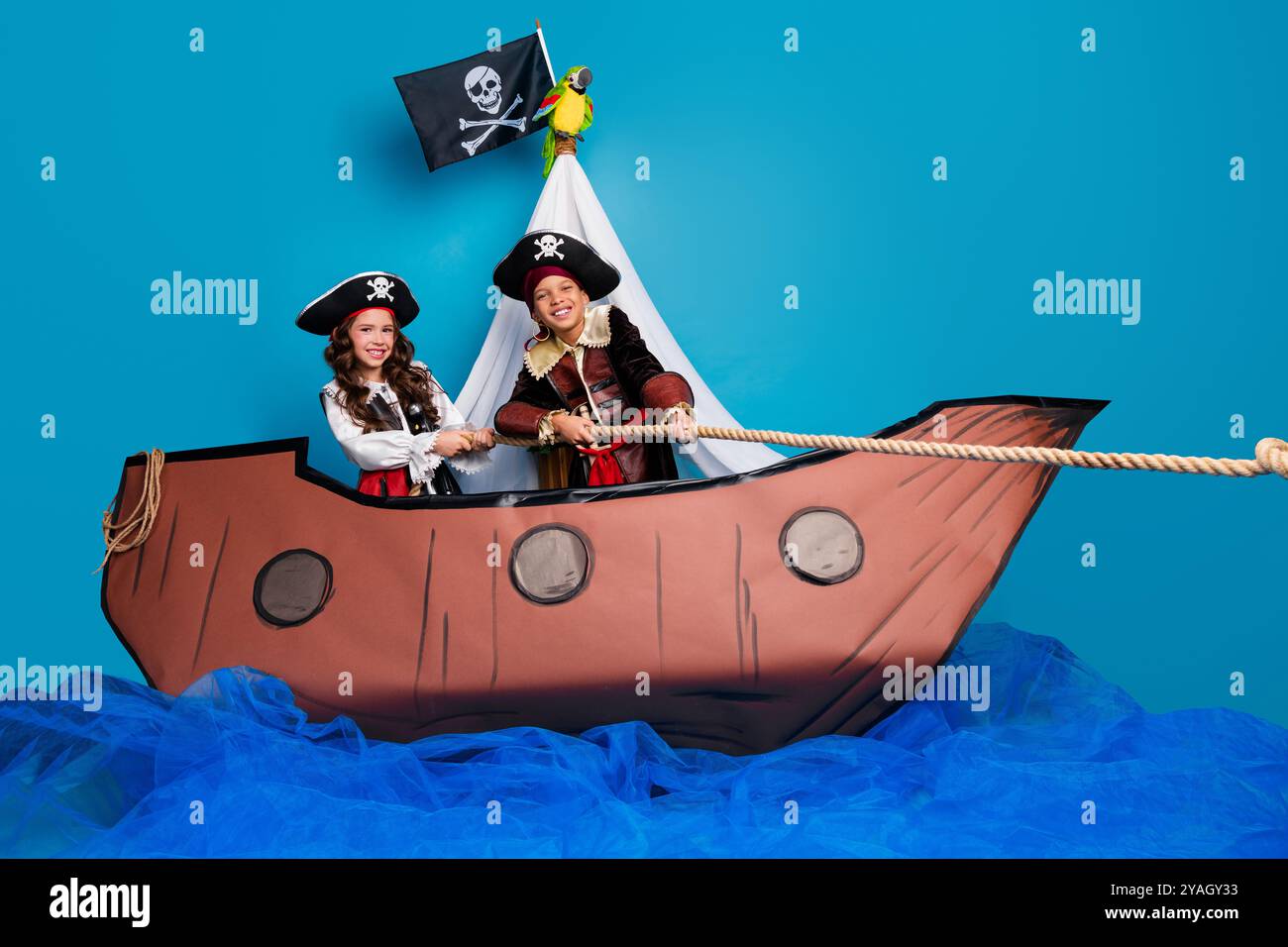 Full body photo of cute little boy girl port pulling rope dressed ...