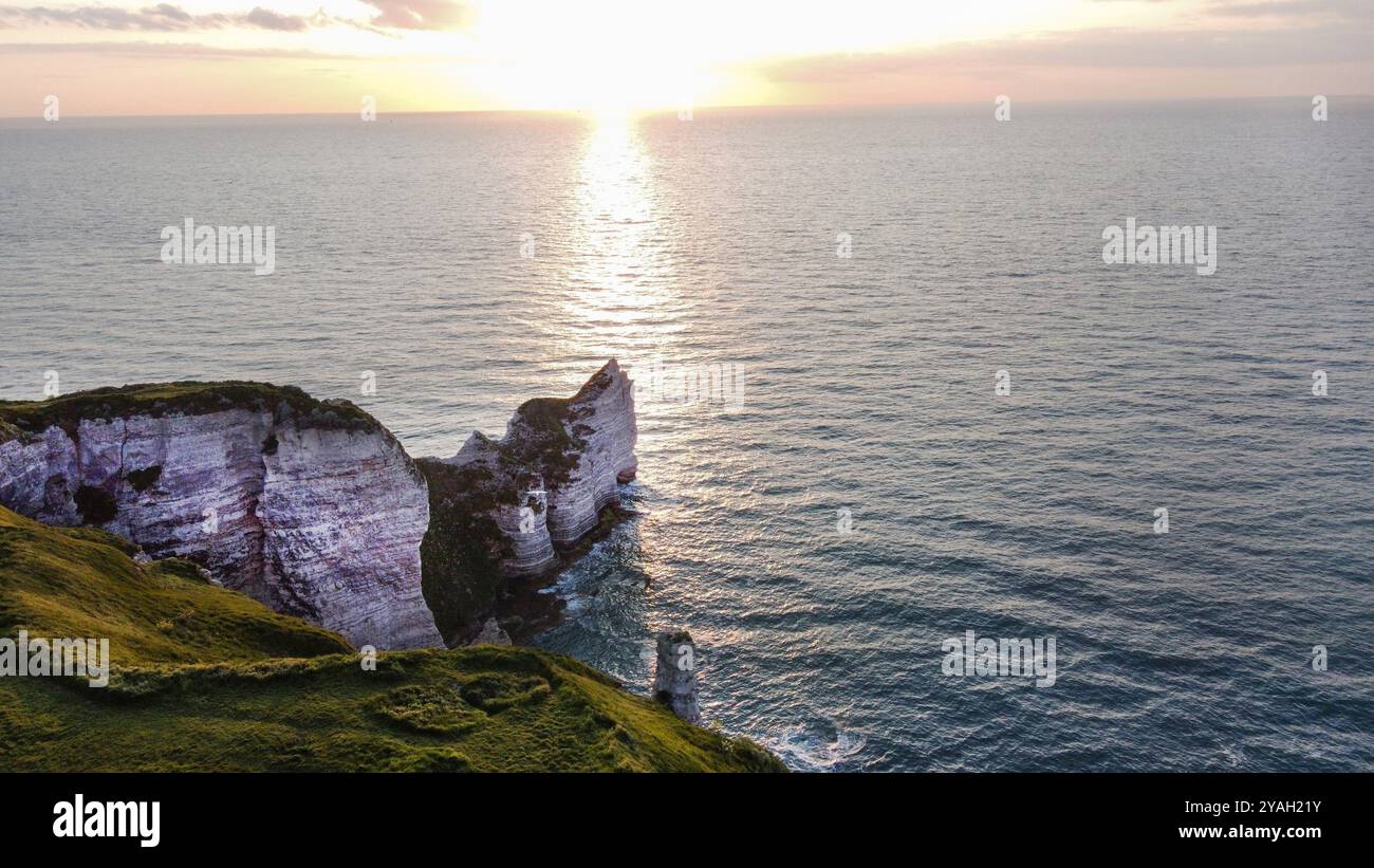 Famous coastline with steep slopes next to Etretat village in Normandy ...
