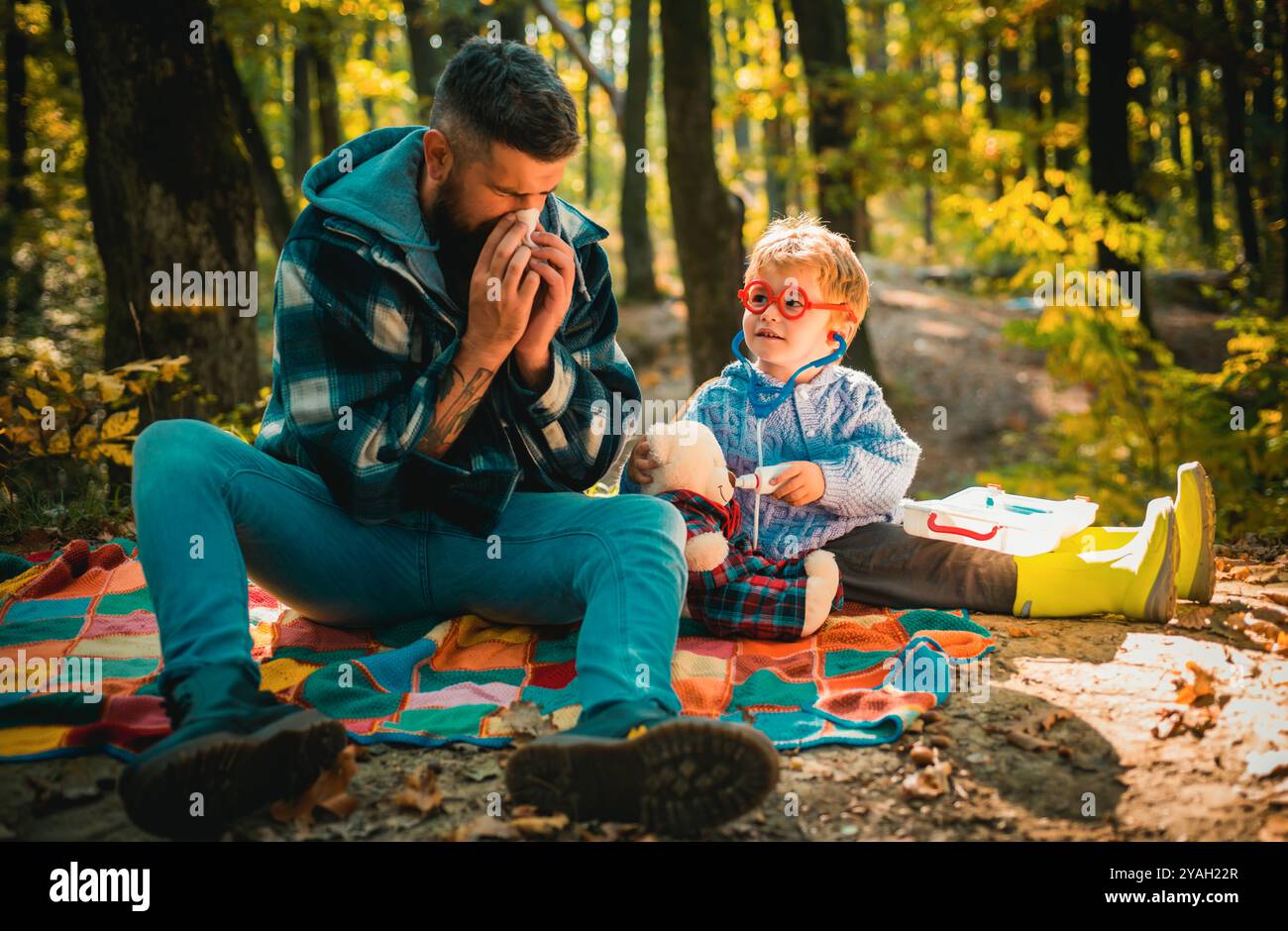 Doctor child in glasses with stethoscope examine patient. Boy in doctor ...
