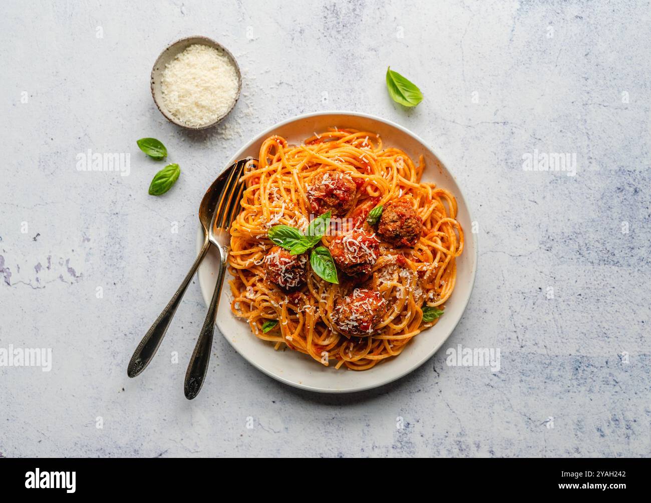 Top view of plate of spaghetti and meatballs on light background Stock ...