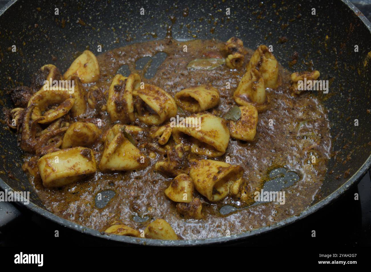 Traditional indian squid curry hi-res stock photography and images - Alamy