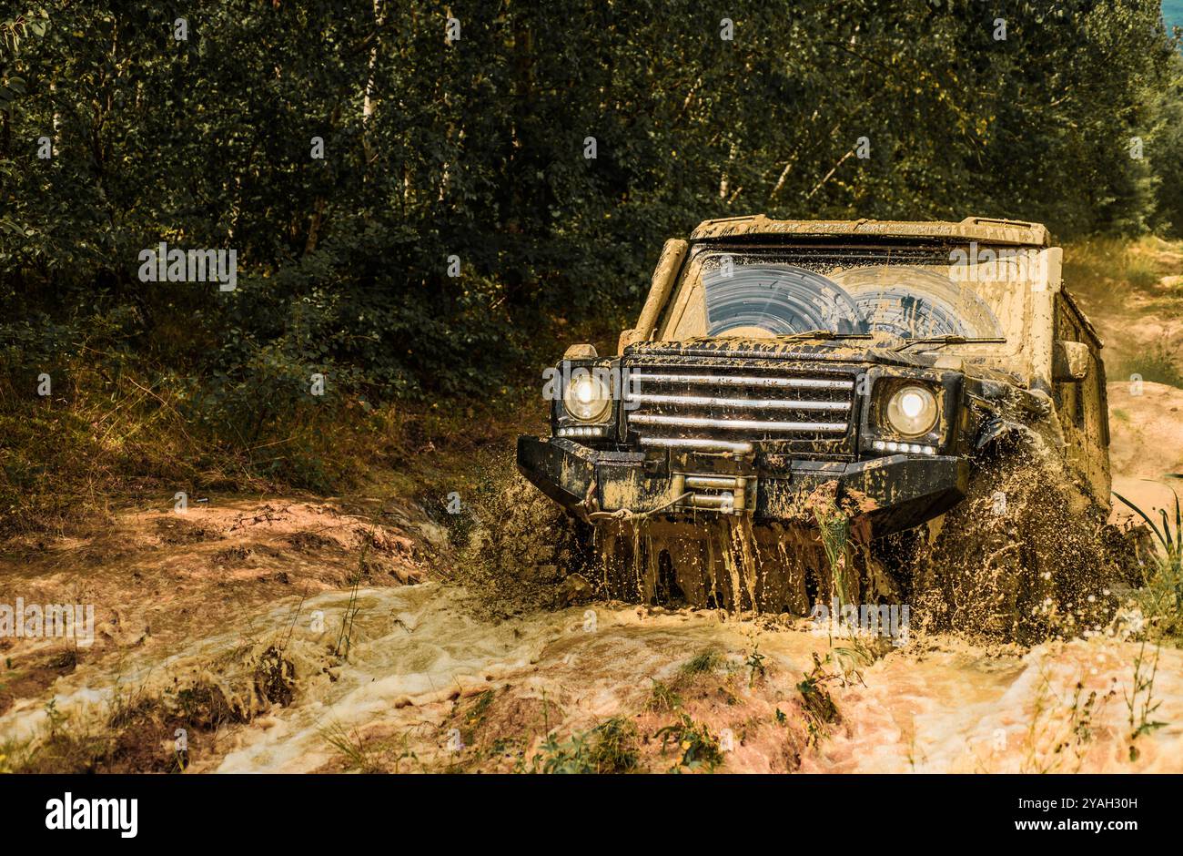 Jeep crashed into a puddle and picked up a spray of dirt. Off road ...