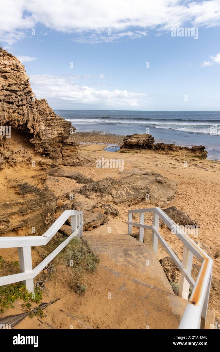 White stairs leading down to rocky sandy beach, Point Lonsdale Stock ...