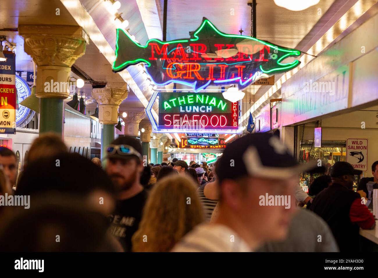 Inside crowded Pike Place market place in Seattle neon signs Stock ...