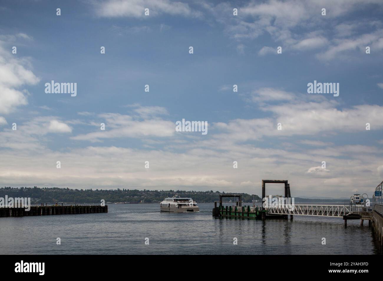 Ferry ship pulling away from pier in Puget Sound Seattle Stock Photo ...
