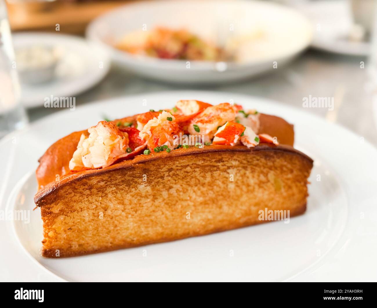 Lobster Roll at a classy dinner Stock Photo - Alamy