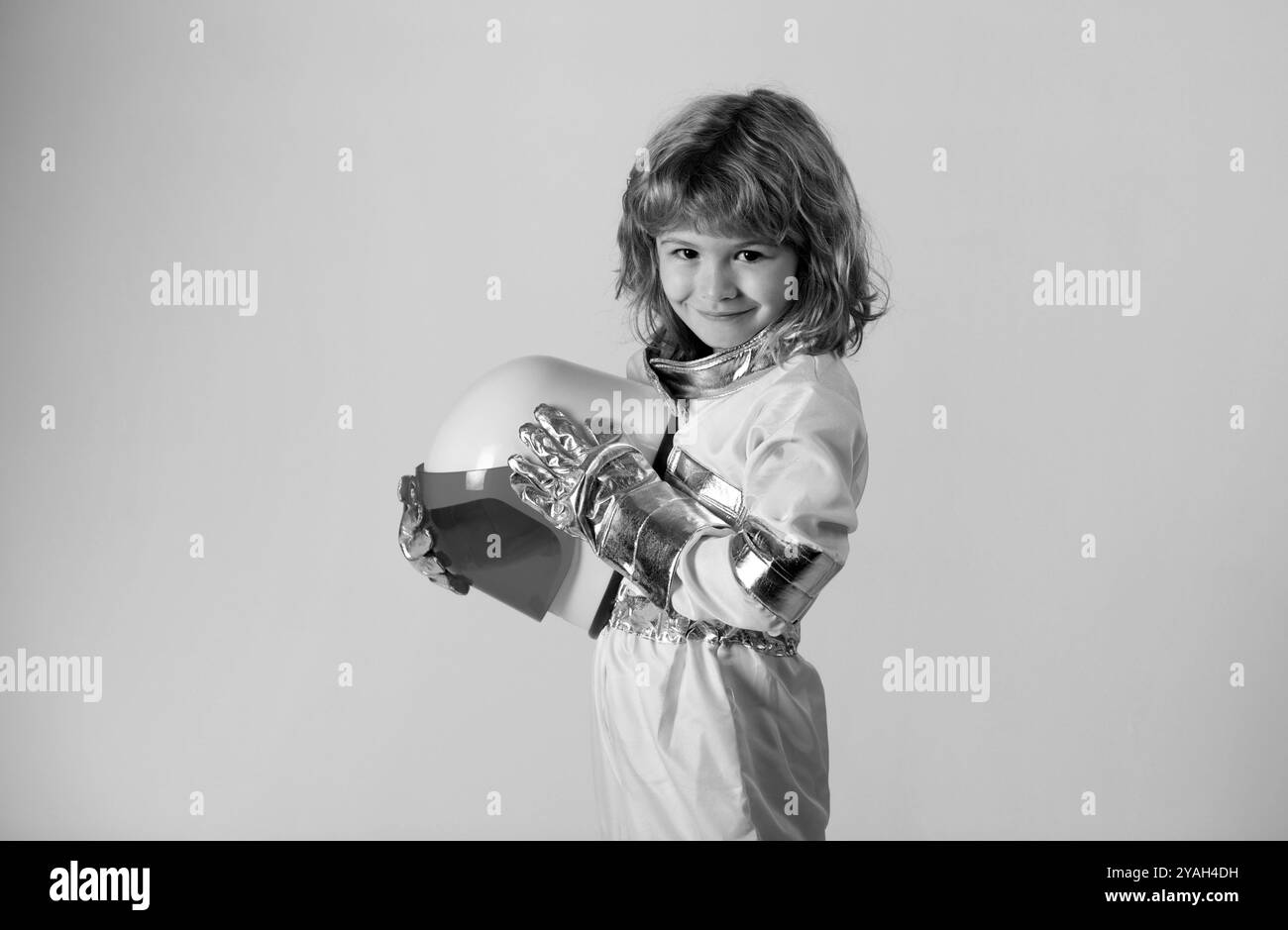 Kid boy exploring space. Portrait of cute kids in space suits holding ...