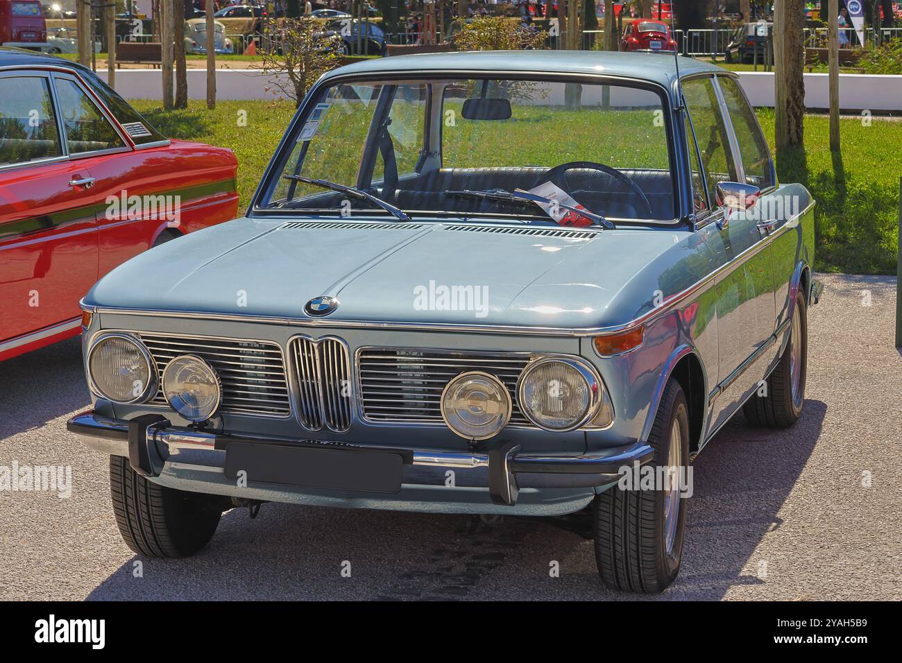 Pristine restored classic bmw 2002 is parked on display at a classic ...