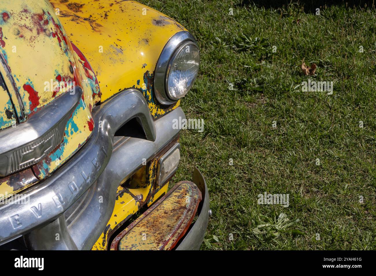 Close up of the front of a classic yellow chevrolet 3100 pickup truck ...
