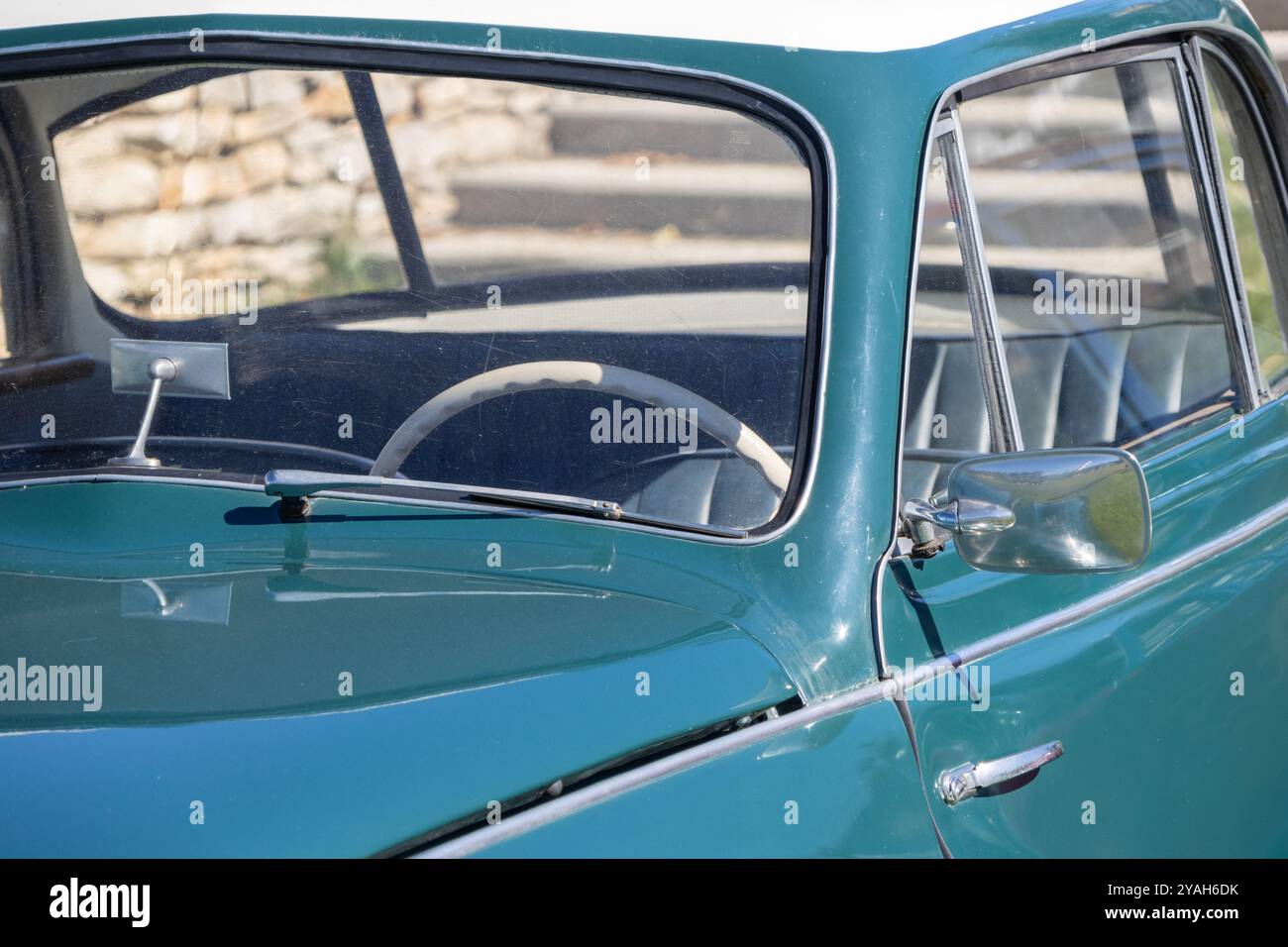 Sunlight reflecting on the turquoise body of a simca aronde vintage car ...