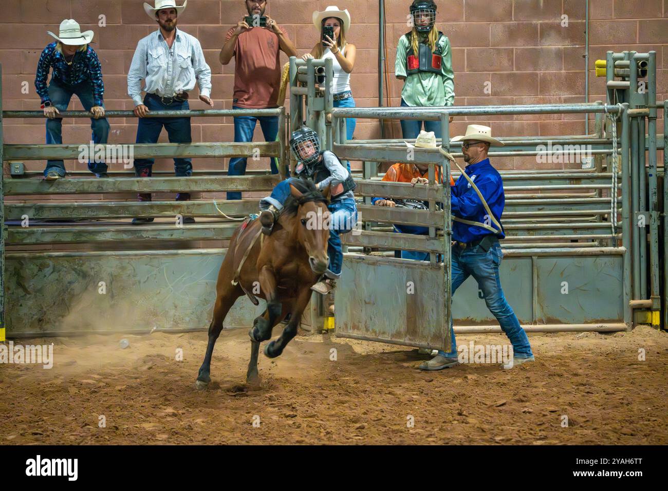 A young cowgirl loses her balance on a bucking horse at the Moab Junior ...