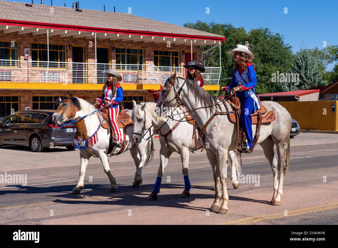 The rodeo queen and her attendents on horseback in the Fourth of July ...