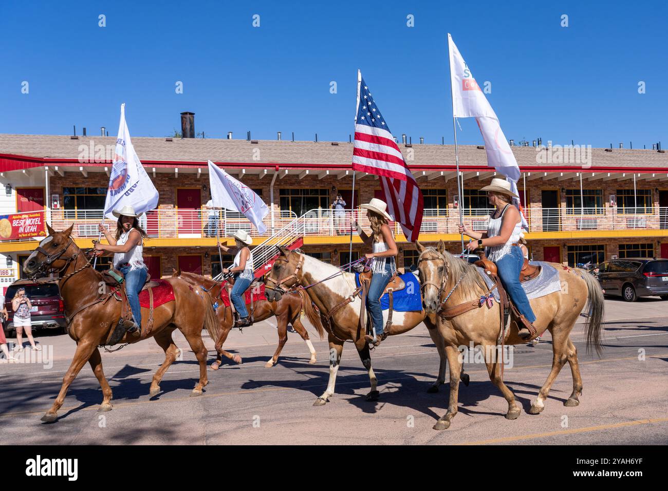 An equestrian drill team on horseback with an American flag in the ...