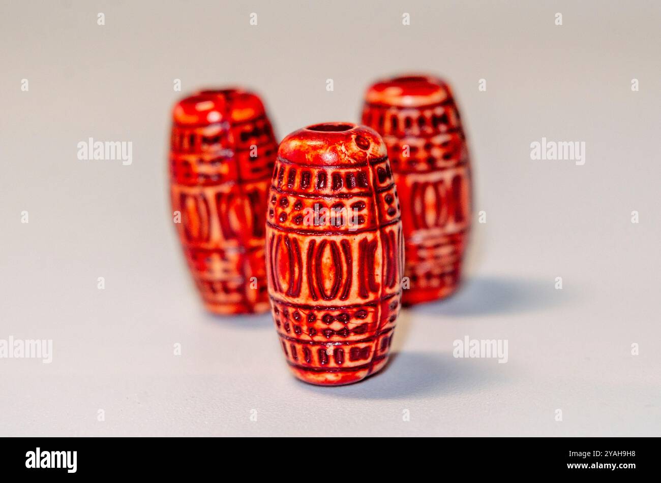 Barrel shaped red toggle buttons on a white background Stock Photo - Alamy
