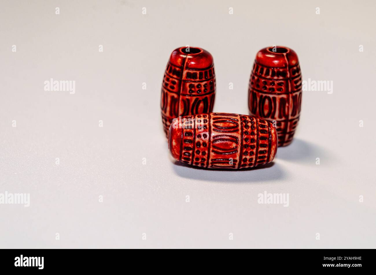 Barrel shaped red toggle buttons on a white background Stock Photo - Alamy
