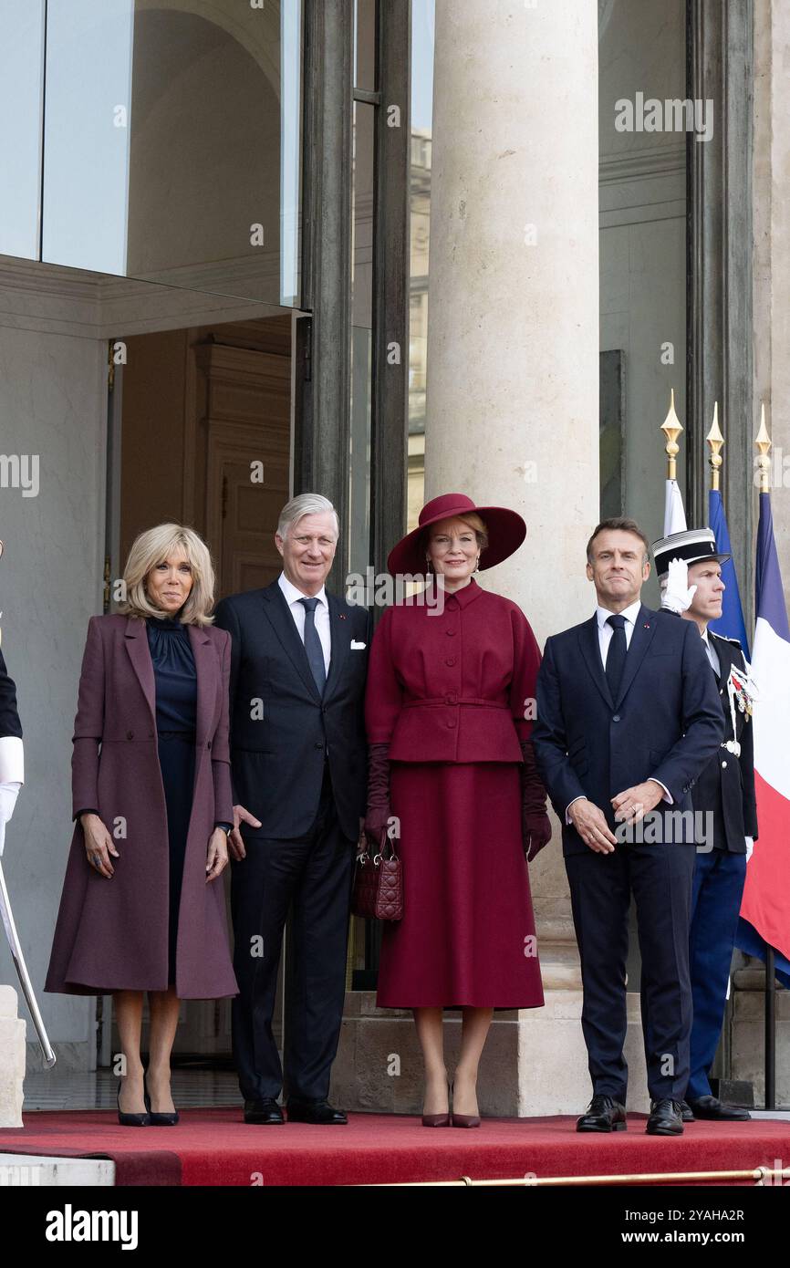 French President Emmanuel Macron and his wife Brigitte Macron welcome ...