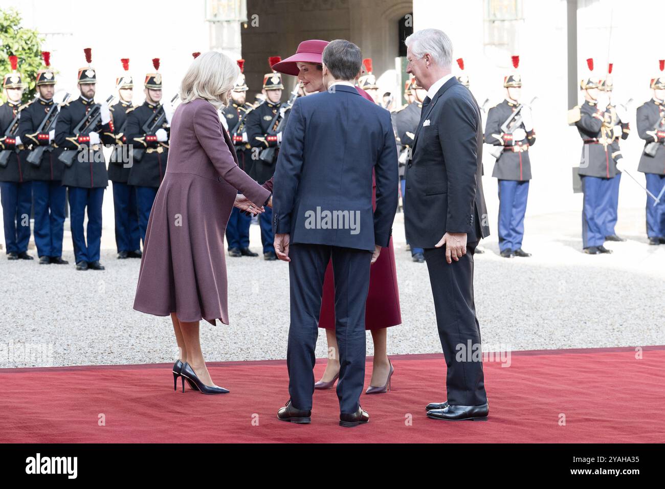 French President Emmanuel Macron and his wife Brigitte Macron welcome ...