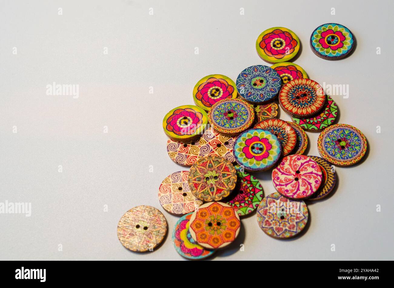 Collection of colourful buttons on a white background Stock Photo - Alamy