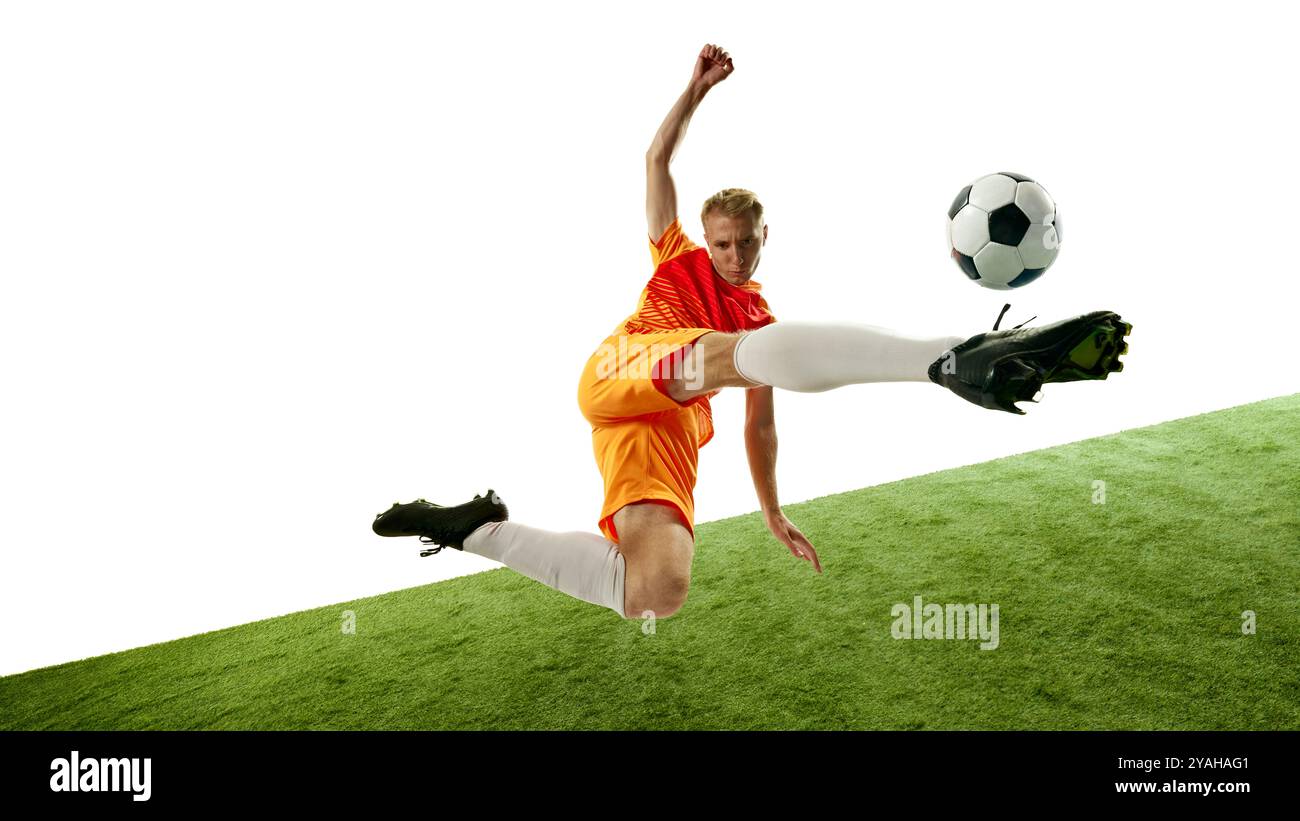 Dramatic mid-air soccer move, where sport athlete prepares to strike ...
