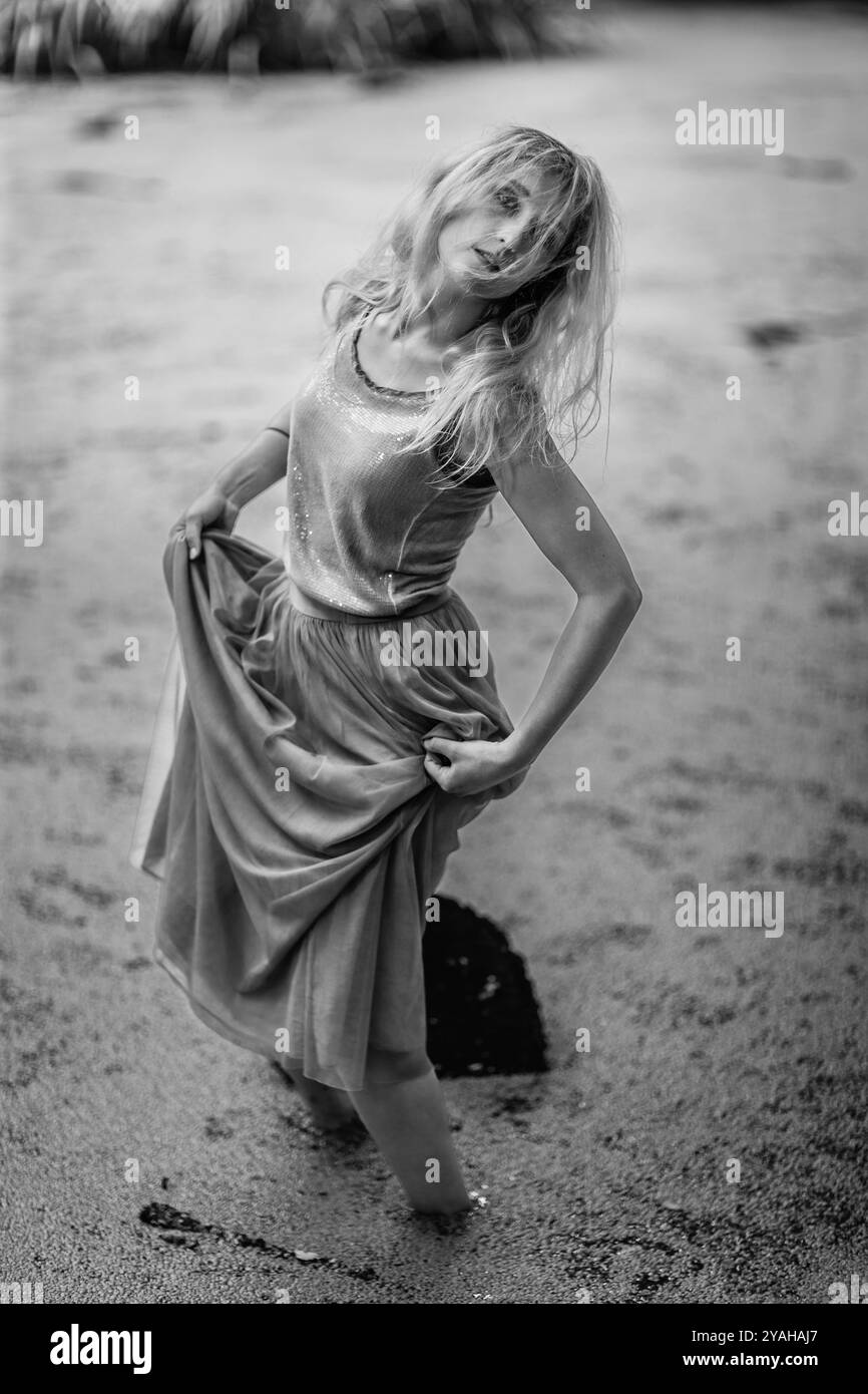 A black and white image of a model posing in a swamp in London Stock ...