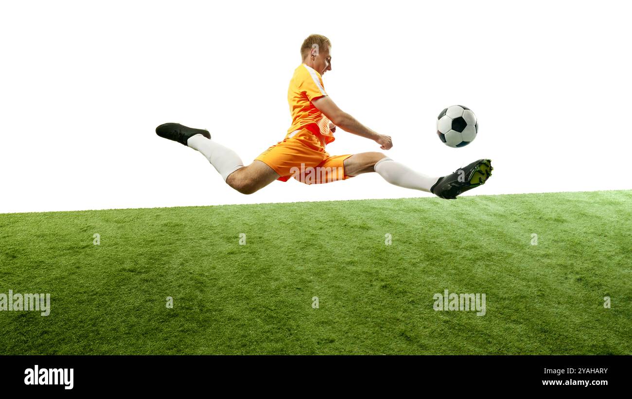 High-flying kick from determined football player, showing both strength ...