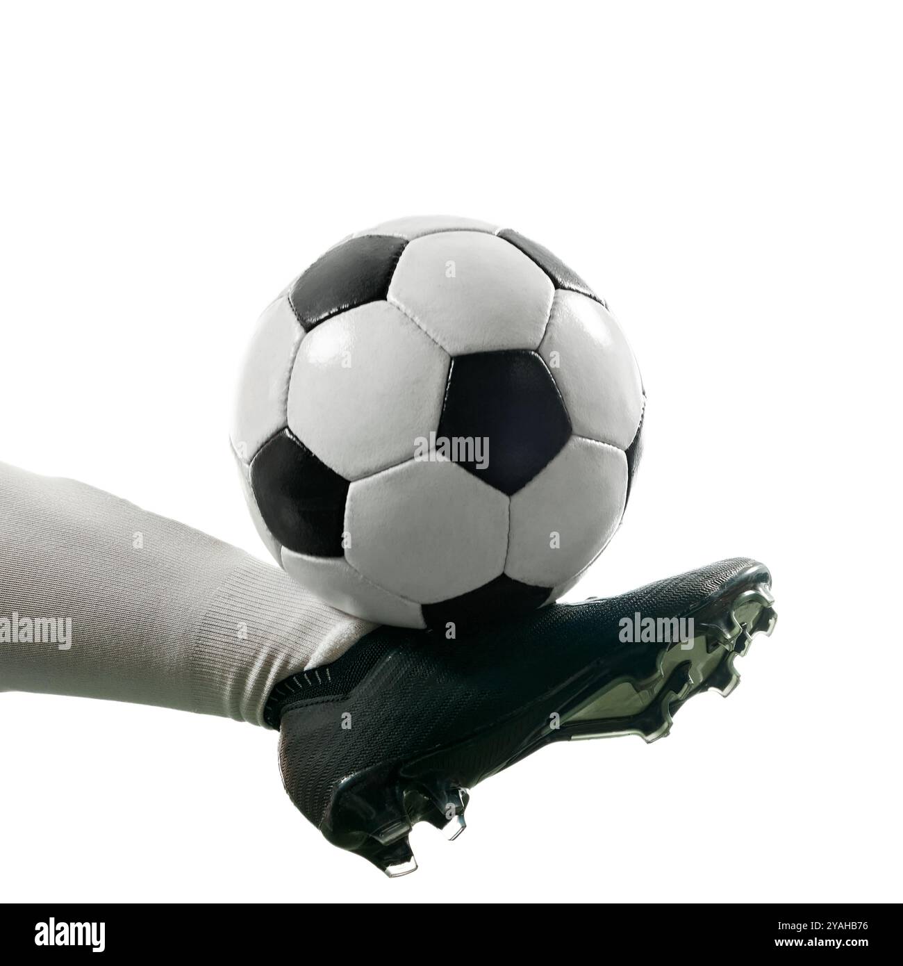 Football player's powerful kick in mid-air, ball lifted perfectly for ...