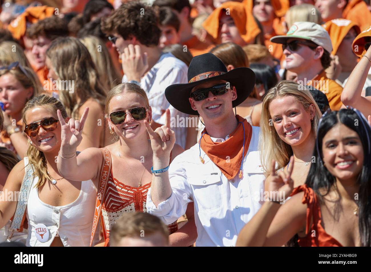 DALLAS, TX - OCTOBER 12: Student fans hold up the Hook 'Em Horns sign ...