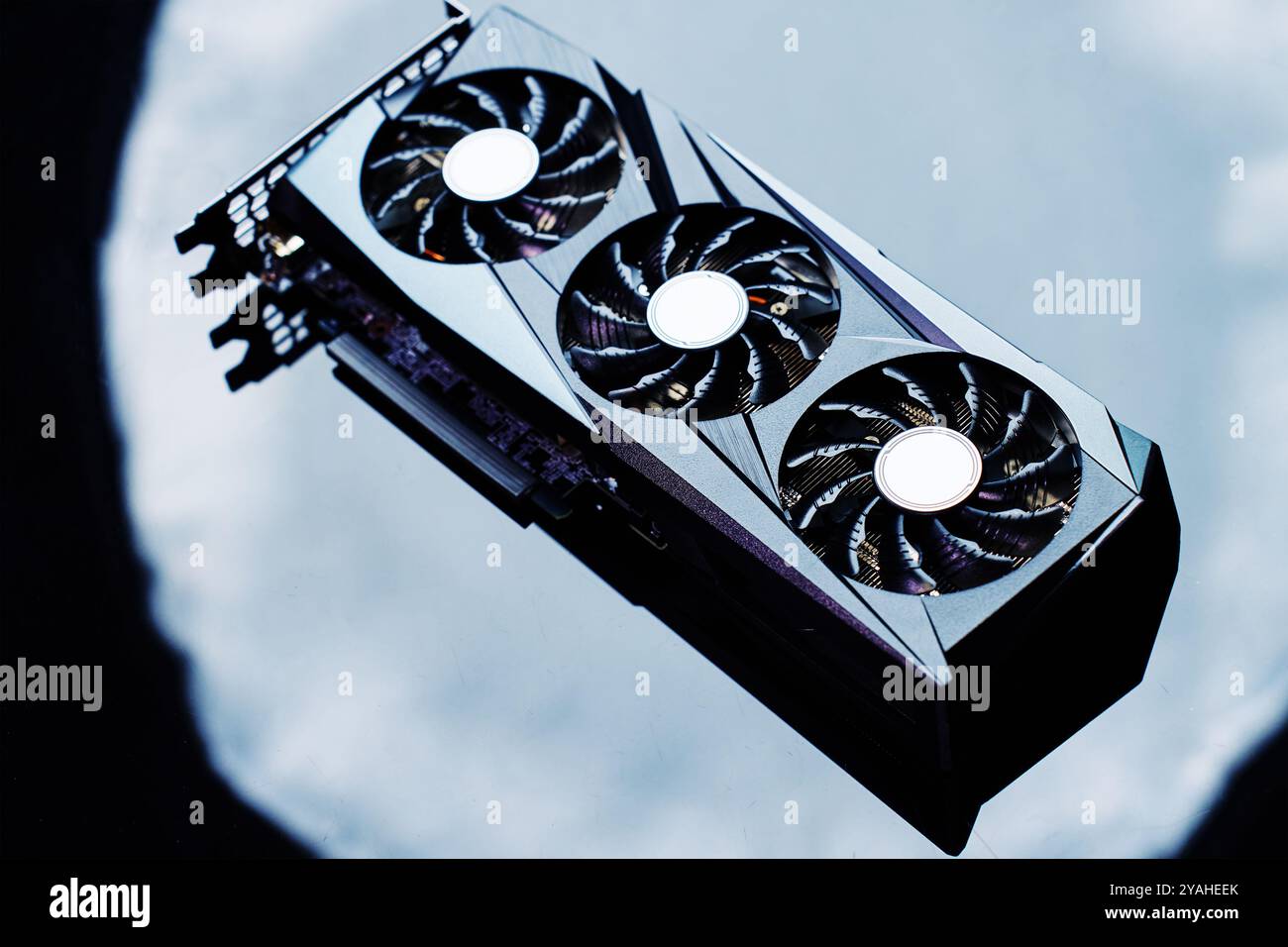 Close-up of high-performance graphics card with three cooling fans on ...