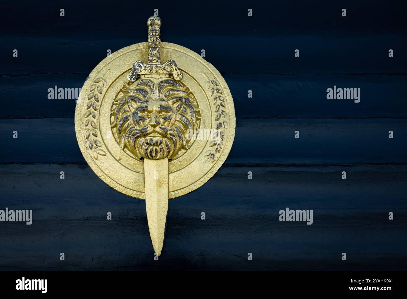 Shield with lion head isolated on dark wooden background. Royal Shield ...
