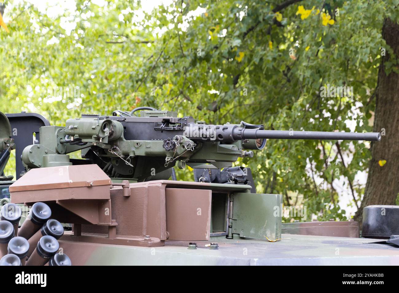 Machine gun on the roof of a modern tank, close-up. Exhibition of ...