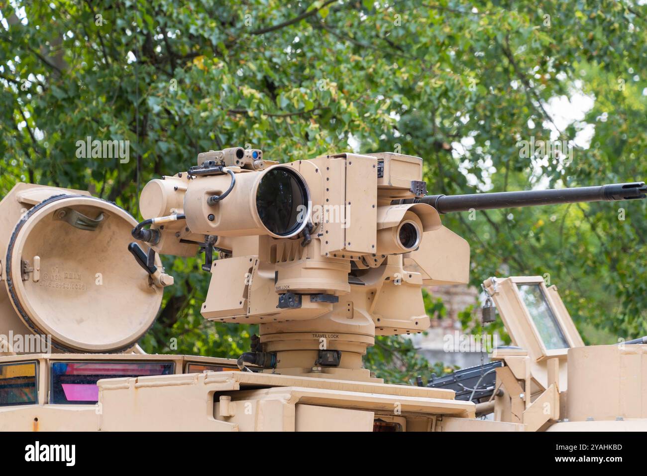 Machine gun on the roof of a modern tank, close-up. Exhibition of ...