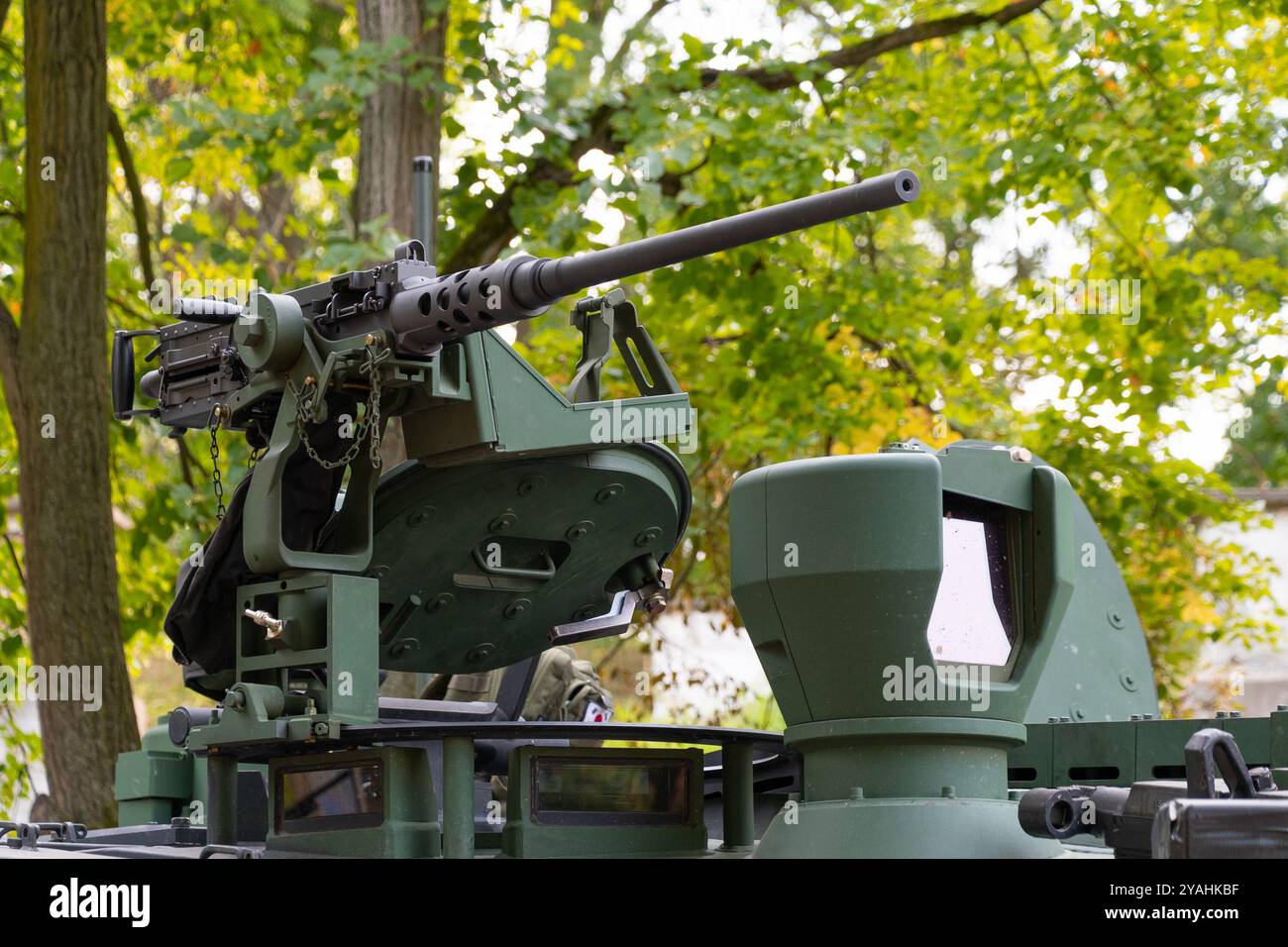 Machine gun on the roof of a modern tank, close-up. Exhibition of ...