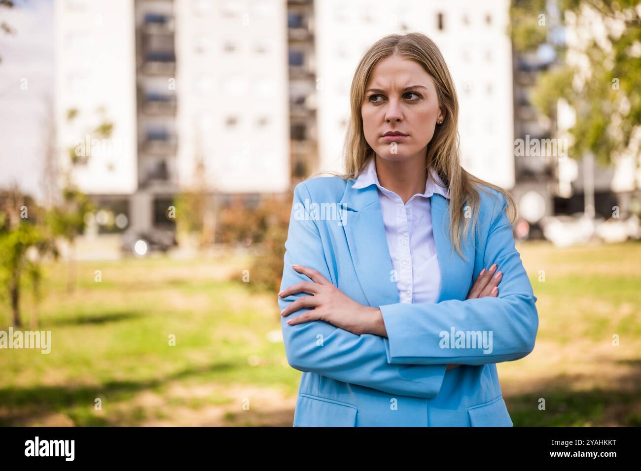 Tired business woman crossed arms hi-res stock photography and images ...