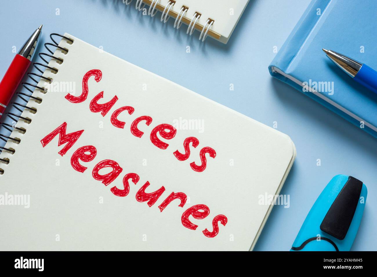 A notebook labeled success measures. Goal setting and tracking ...