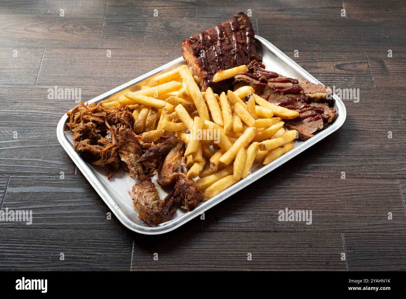 The BBQ Sampler, bar-be-que roast chicken wings, pulled pork and beef ...