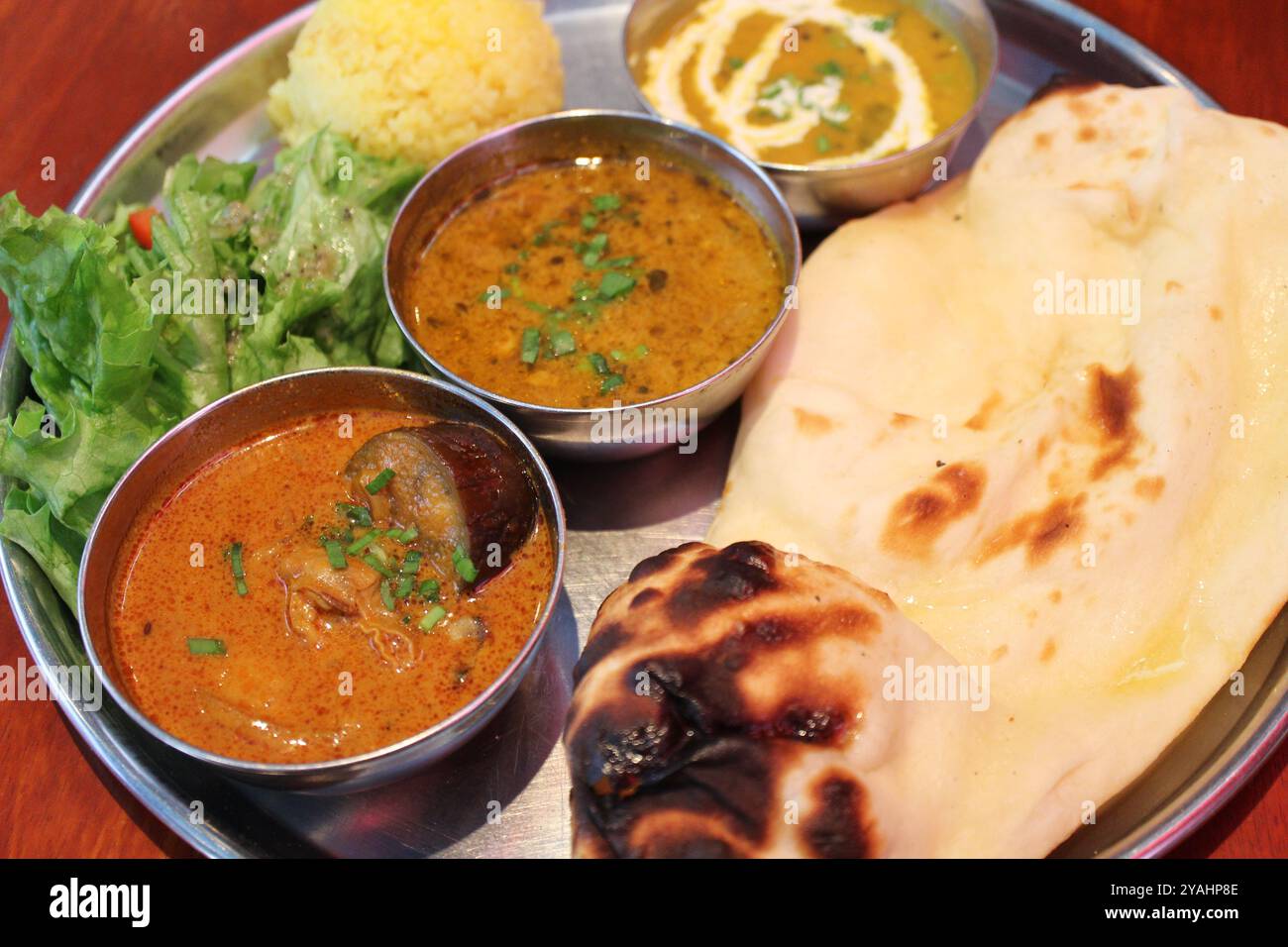 Indian cuisine: curry lunch plate (oyster and eggplant curry, chicken ...