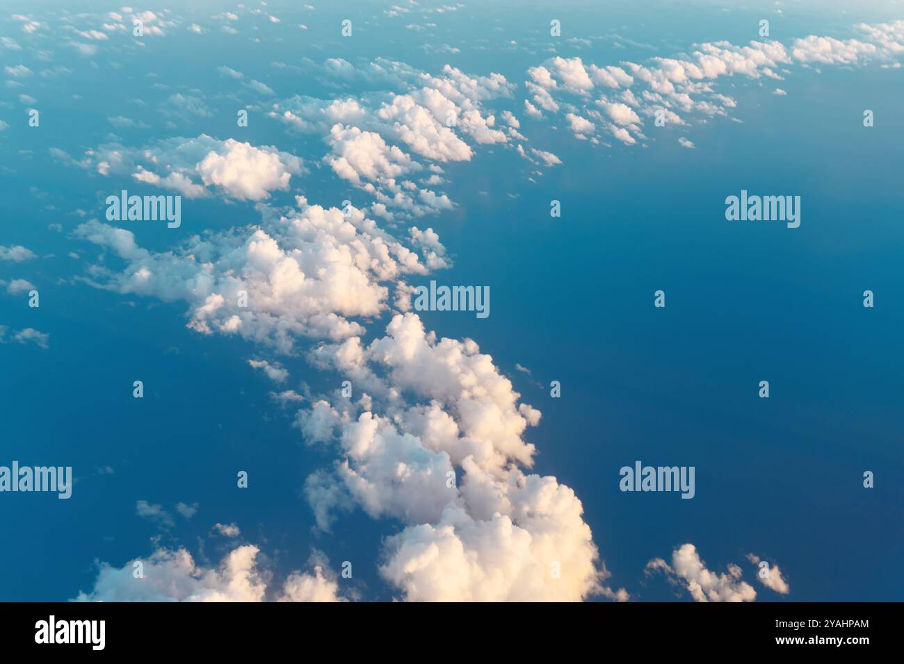 Panorama of clouds over blue ocean. Overhead perspective of soft clouds ...