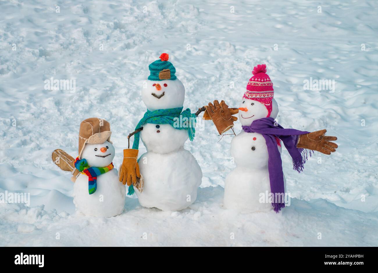 Cute snowman in hat and scarf on snowy field. Snowman and snow day ...