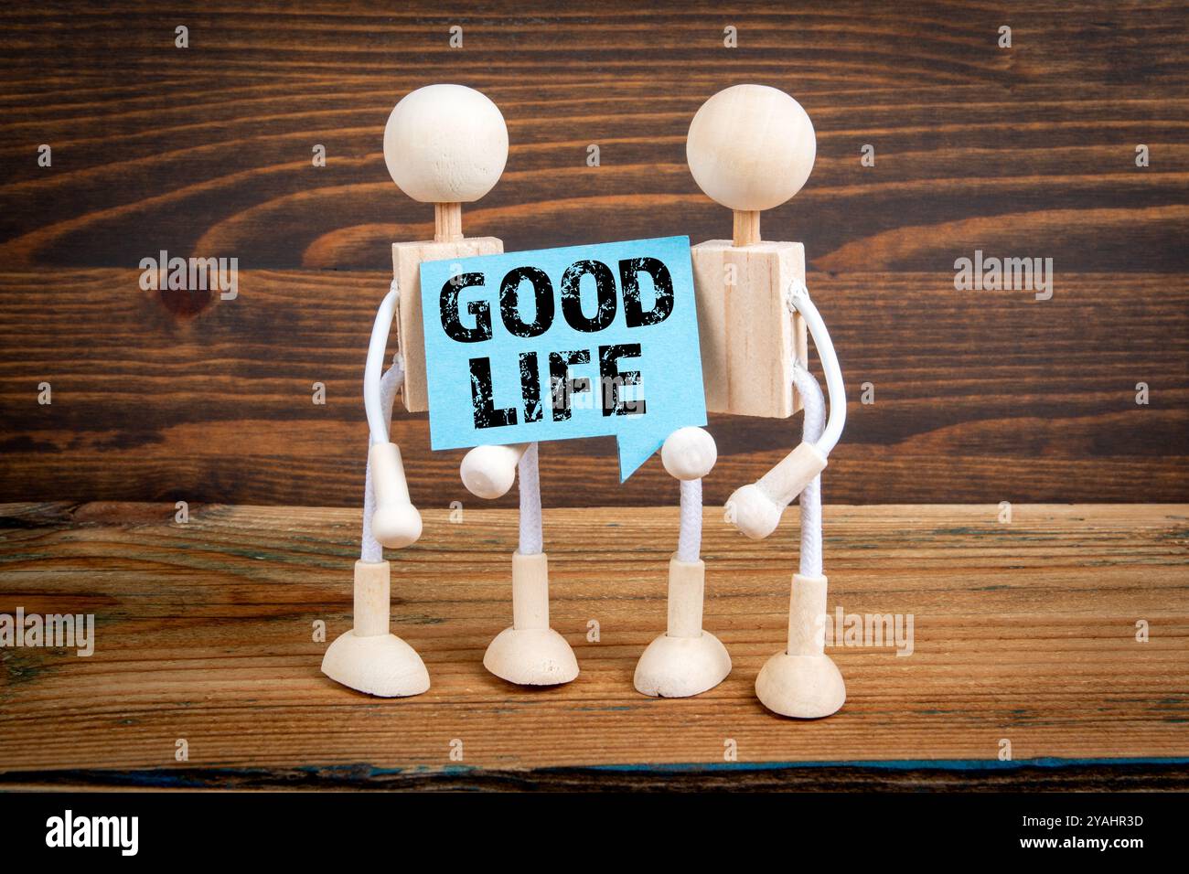 Good Life. Speech bubble with text in the hands of a human figures ...