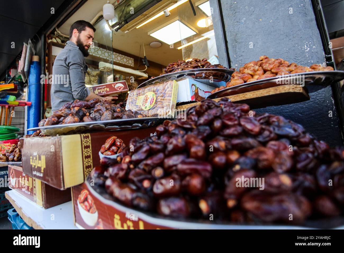 Gaziantep, Turkiye. 16 March 2024. A shopkeeper displays trays of ...