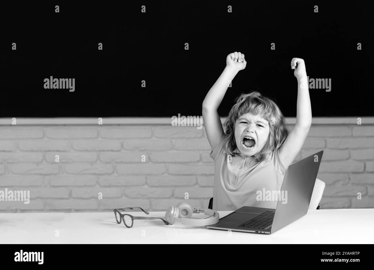 Angry kid in class Black and White Stock Photos & Images - Alamy