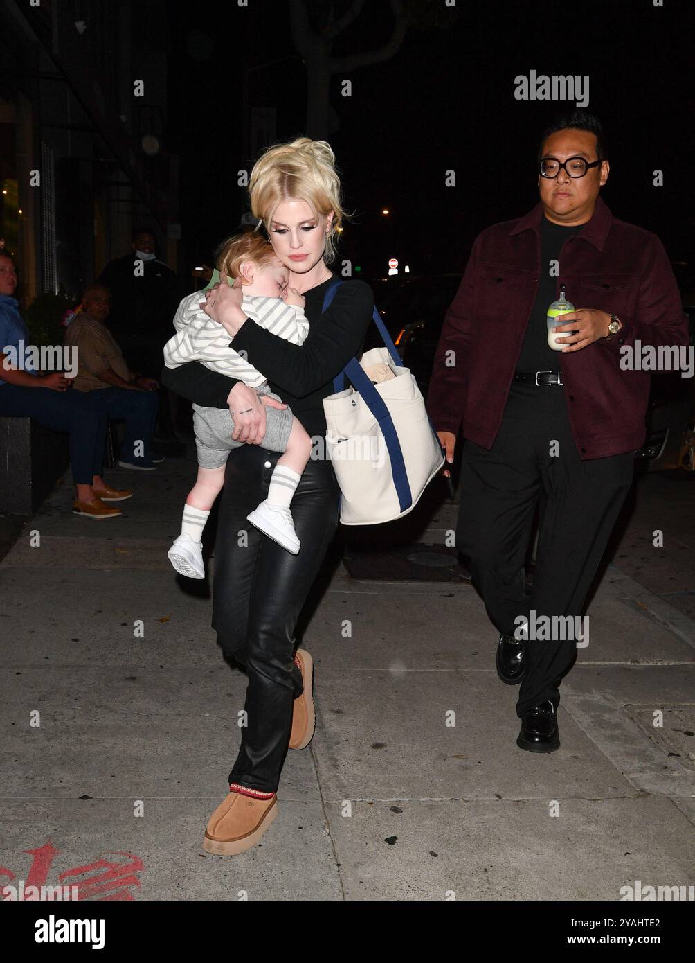 Kelly Osbourne carries her son Sidney Osborne Wilson as she attends ...